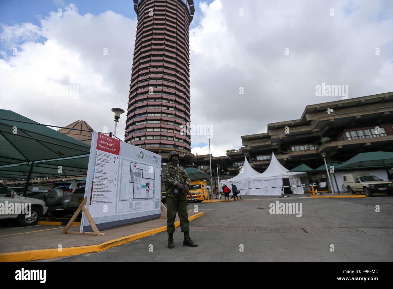 Nairobi. 18th Dec, 2015. A policeman stands guard outside the Kenya ...