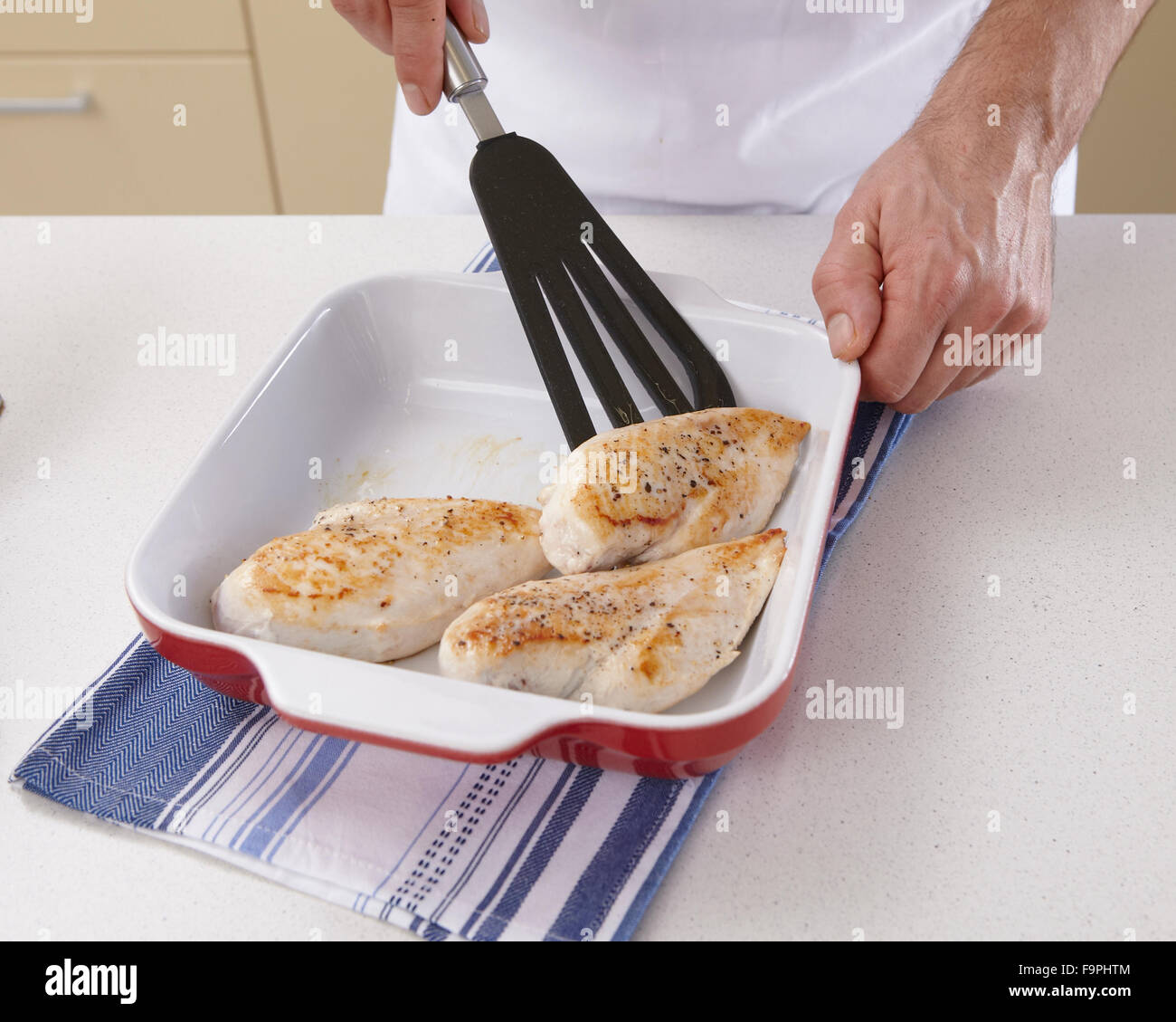 Gratinated chicken steaks + steps Stock Photo - Alamy