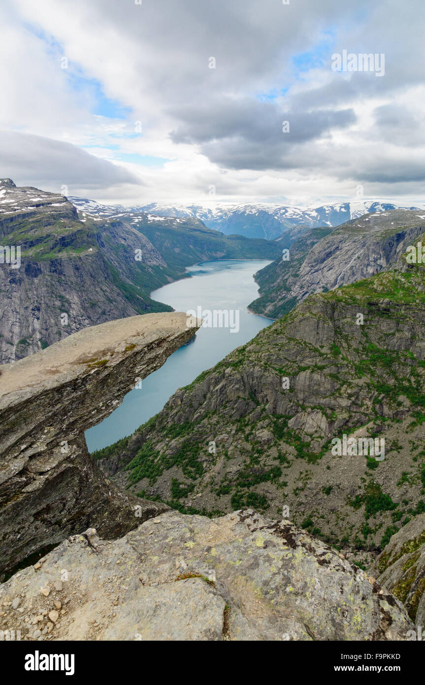 Vertical view on Troll's tongue (Trolltunga) rock above lake ...