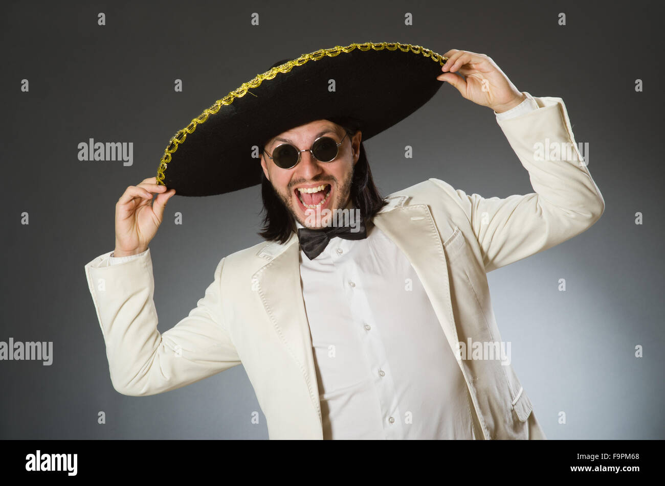 Person wearing sombrero hat in funny concept Stock Photo - Alamy