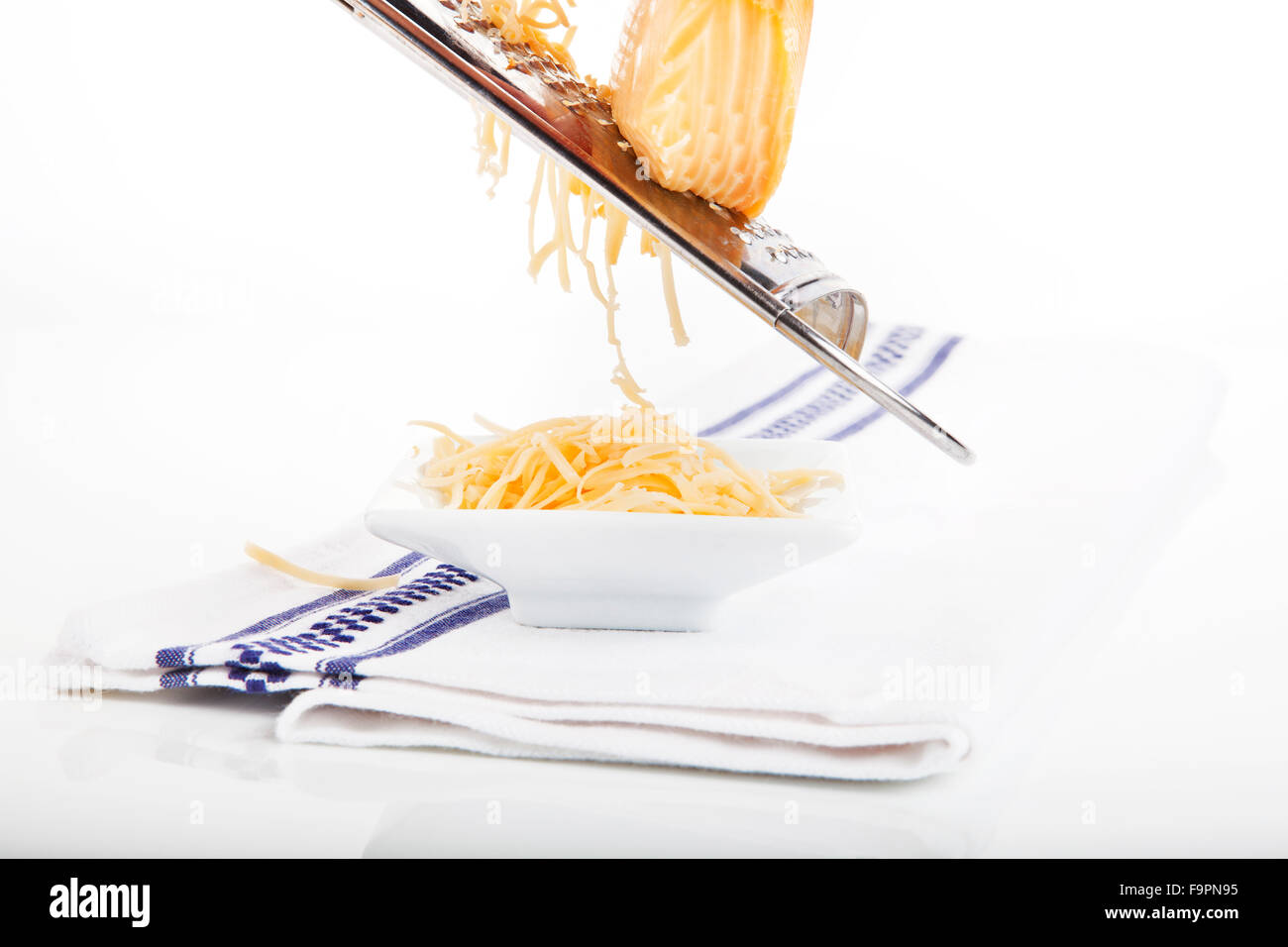 Shredded cheese falling hi-res stock photography and images - Alamy