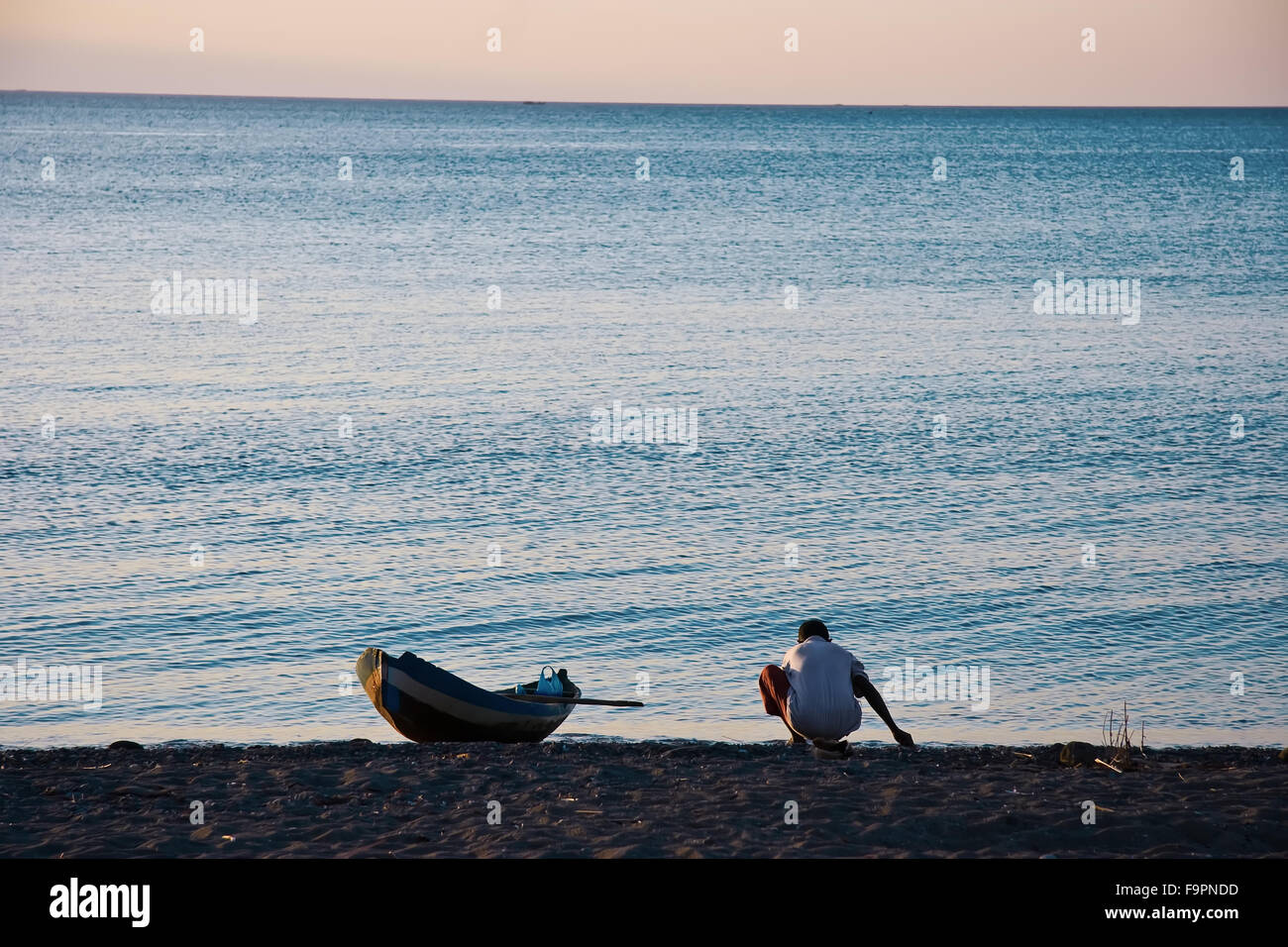 Young man and the see Stock Photo - Alamy