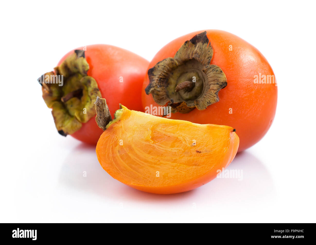 Ripe persimmon isolated on a white Stock Photo - Alamy