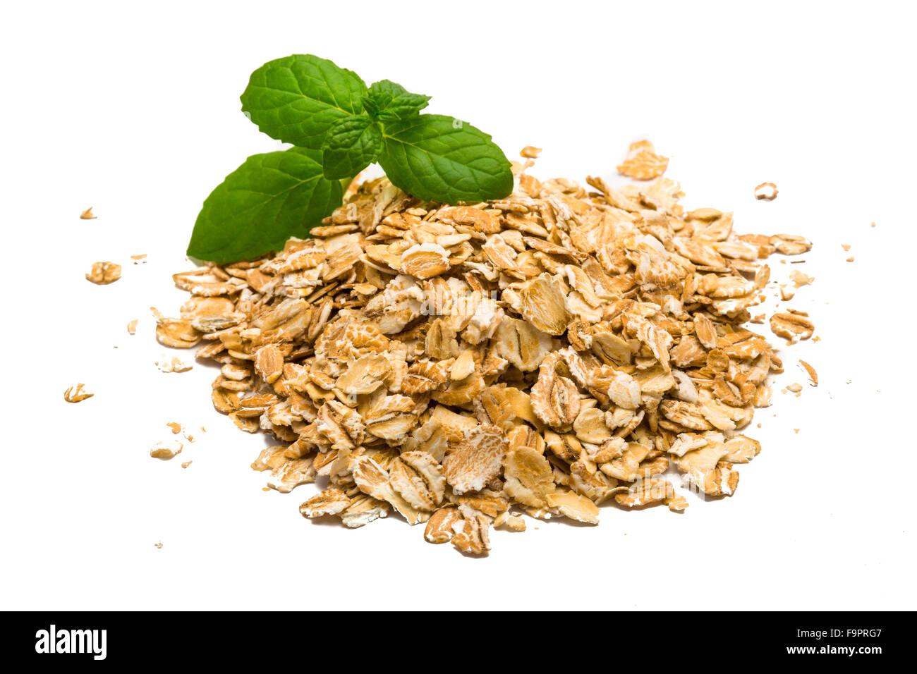 Oats pile with mint branch Stock Photo - Alamy