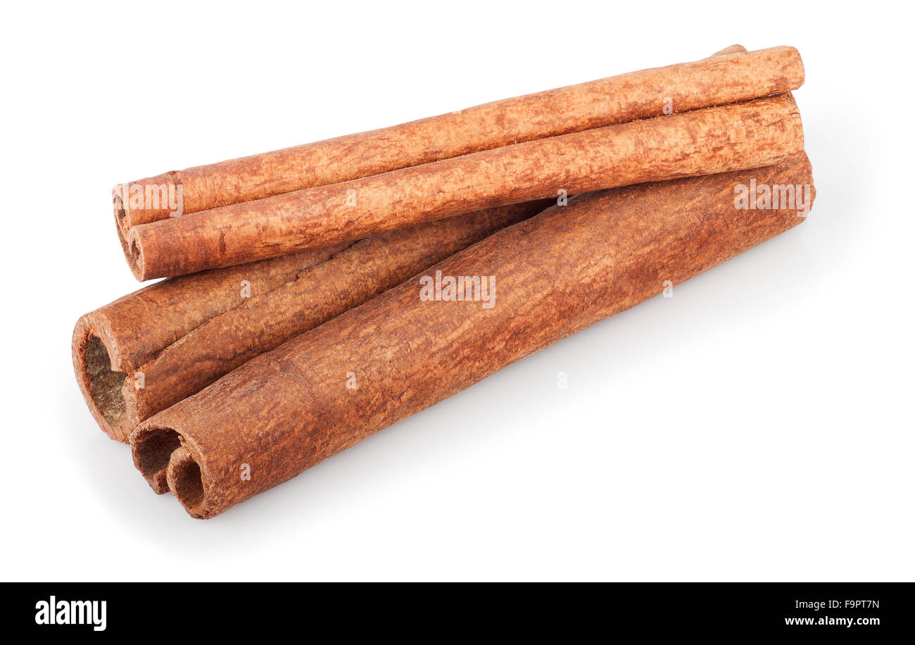 three cinnamon sticks isolated on white background Stock Photo - Alamy