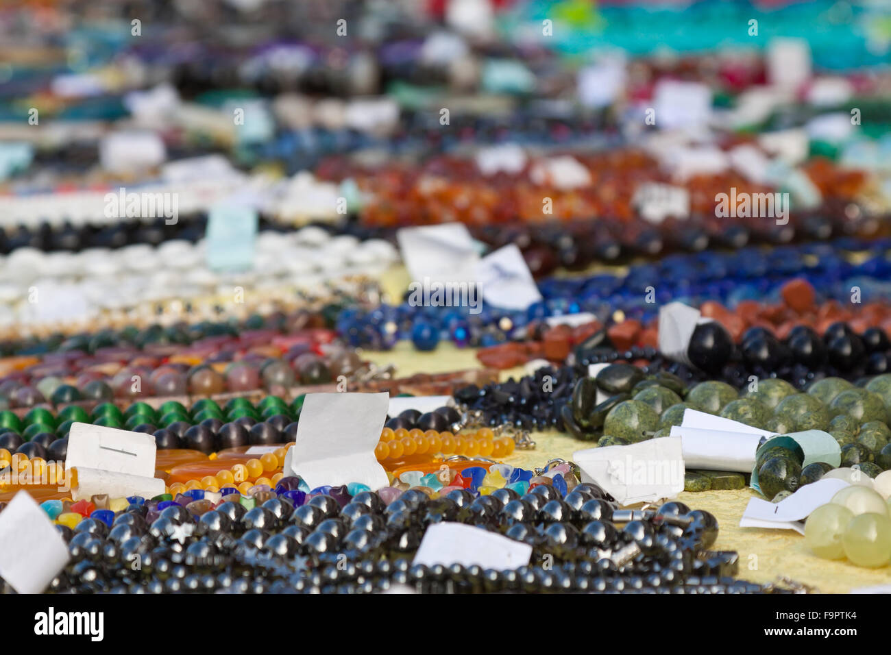 Jewelry from natural gems at store Stock Photo - Alamy