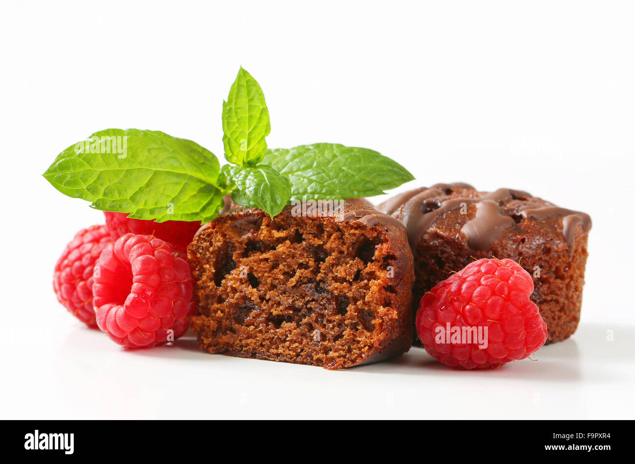 Mini chocolate cakes with raspberry filling Stock Photo - Alamy