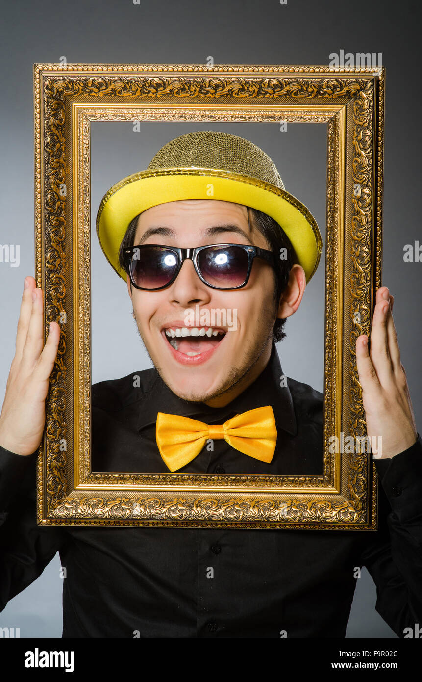 Funny man with picture frame Stock Photo - Alamy