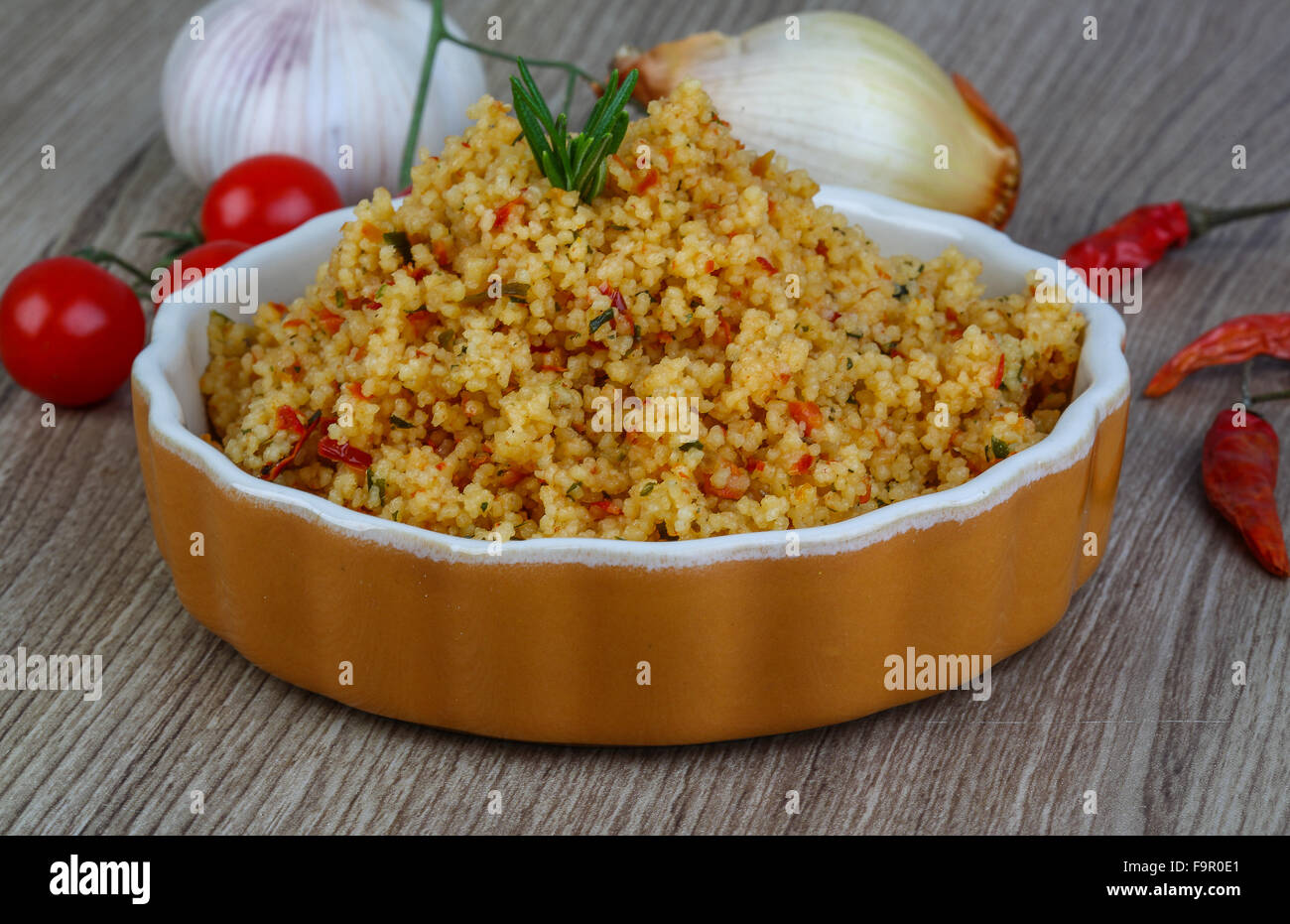 Arabic traditional cuisine - Couscous with tomato and green onion Stock ...