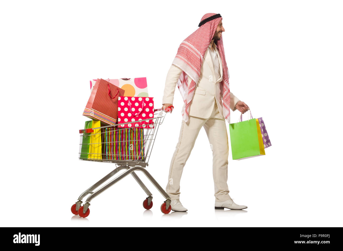 Arab man doing shopping isolated on white Stock Photo - Alamy