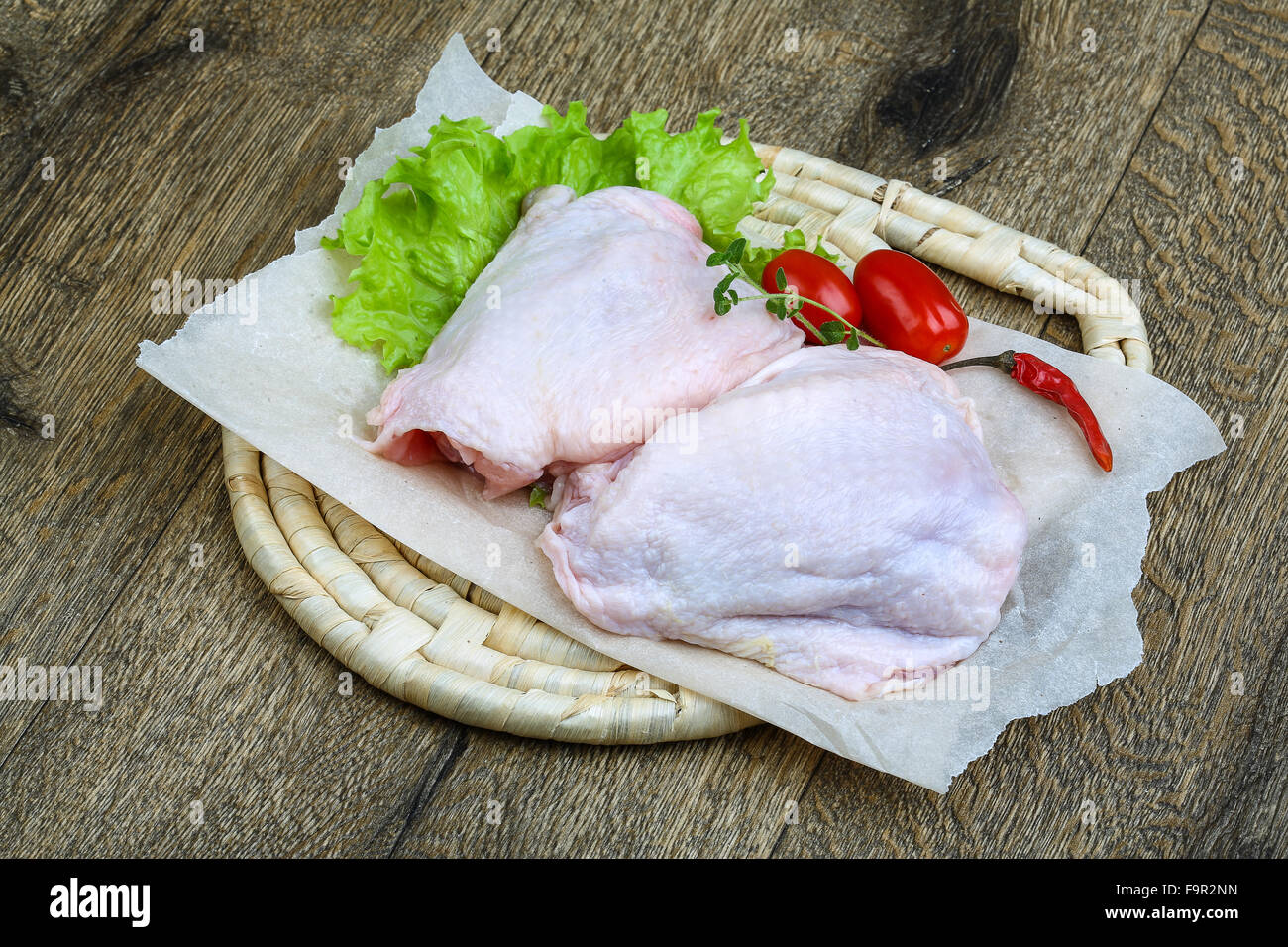 Raw chicken legs meat with herbs and spices ready for cooking Stock ...