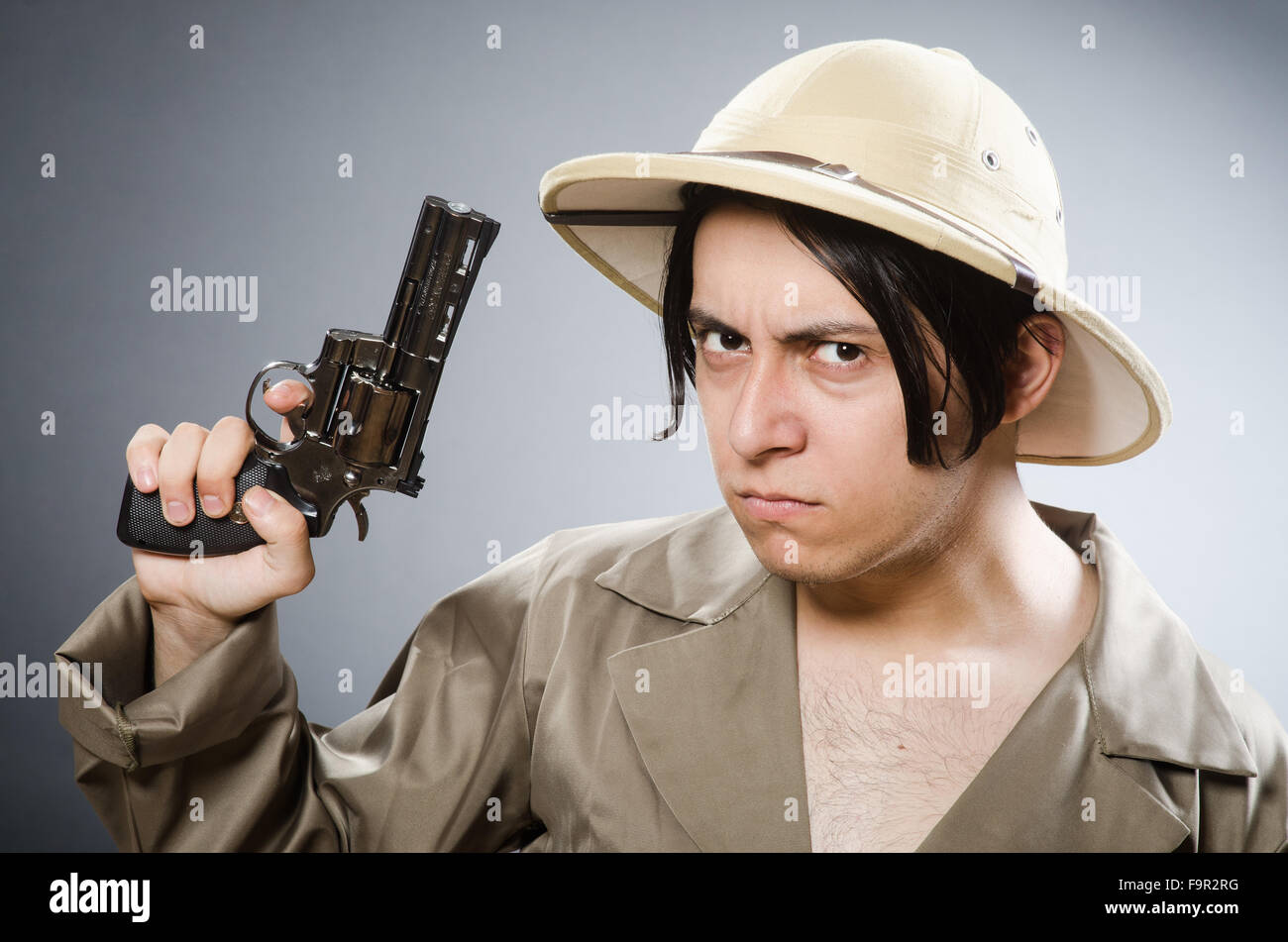 Funny safari traveller in travelling concept Stock Photo - Alamy