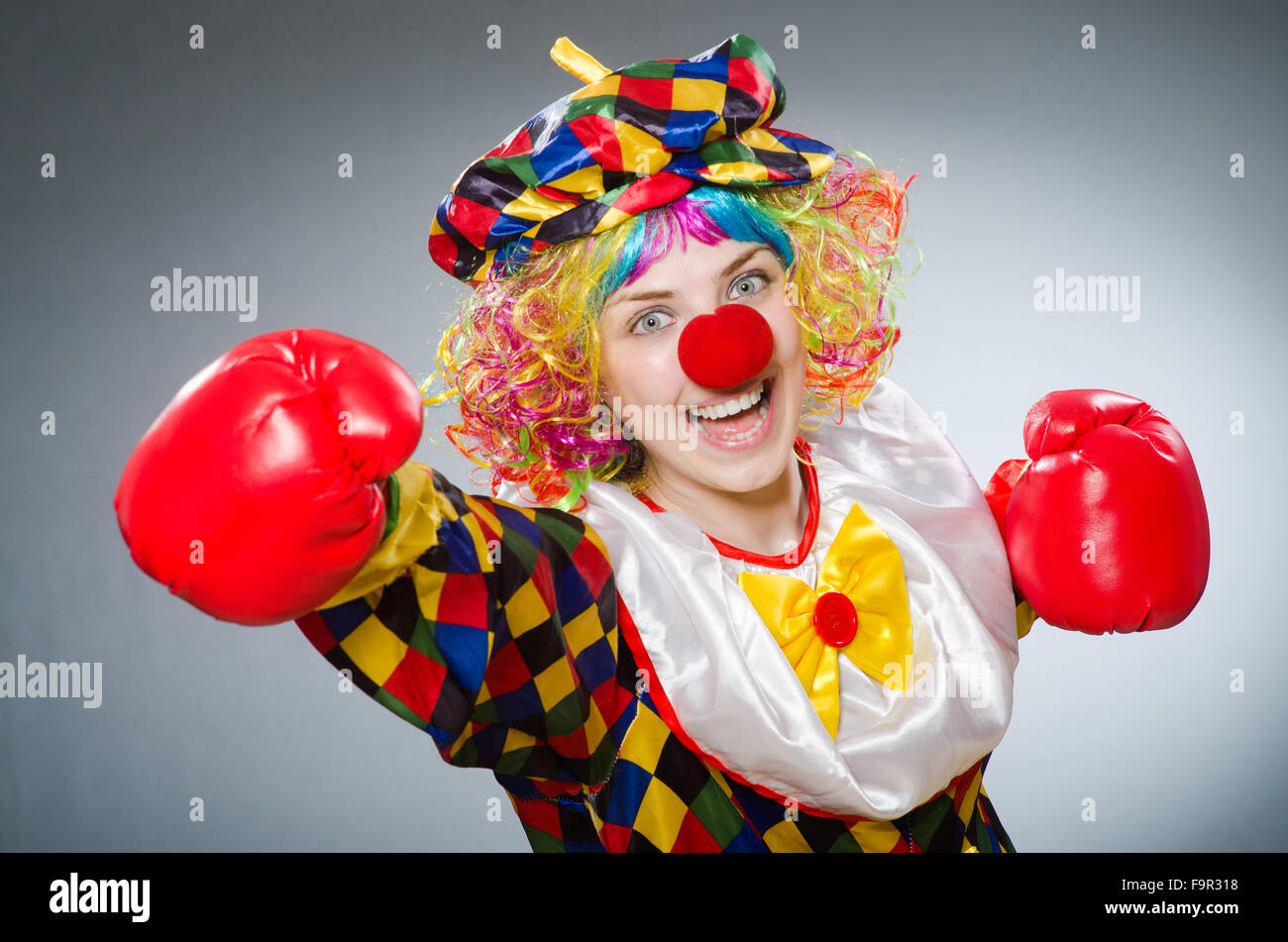Funny clown in comical concept Stock Photo - Alamy