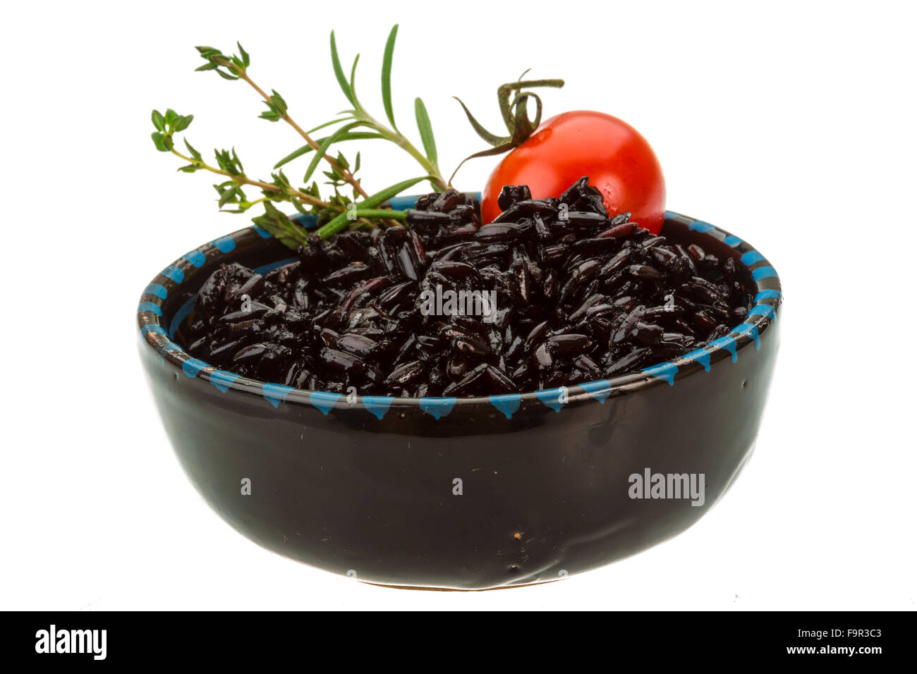 Black boiled rice with thyme Stock Photo - Alamy