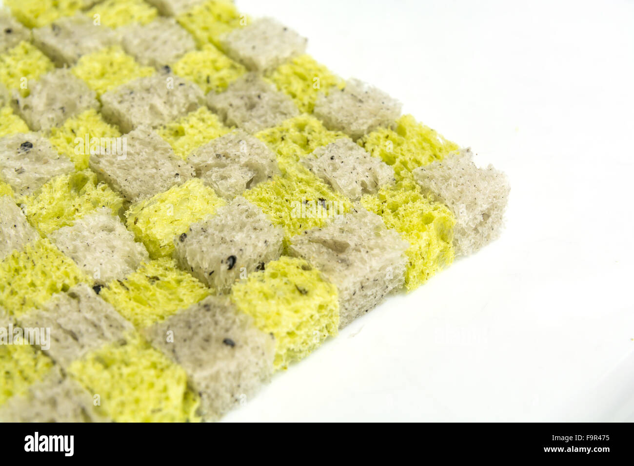 pumpkin and black sesame bread, dice bread conner on white background ...