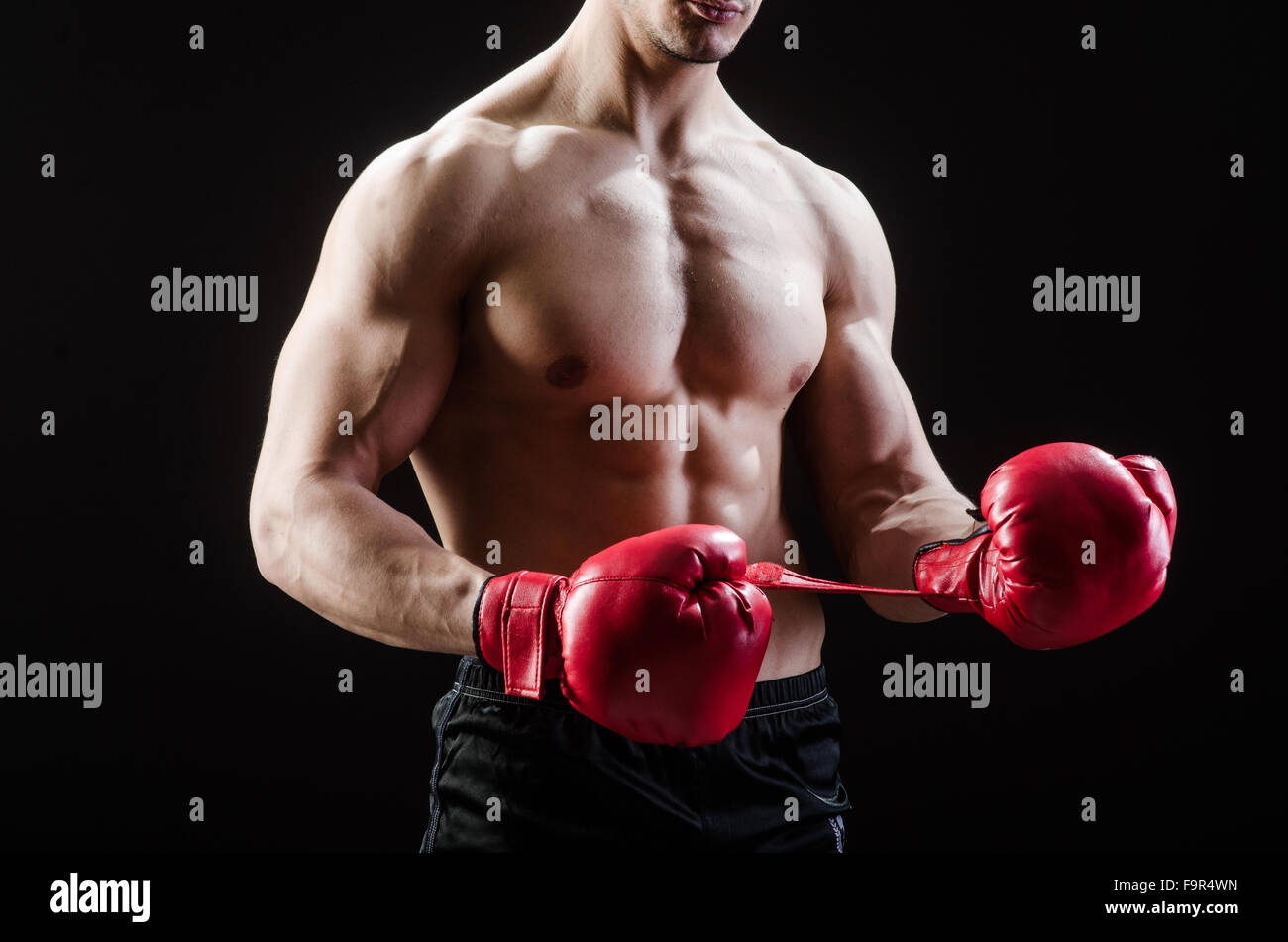 Muscular man in boxing concept Stock Photo - Alamy