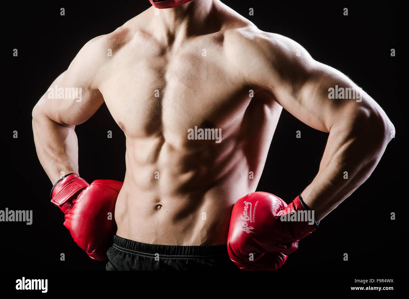 Muscular man in boxing concept Stock Photo - Alamy