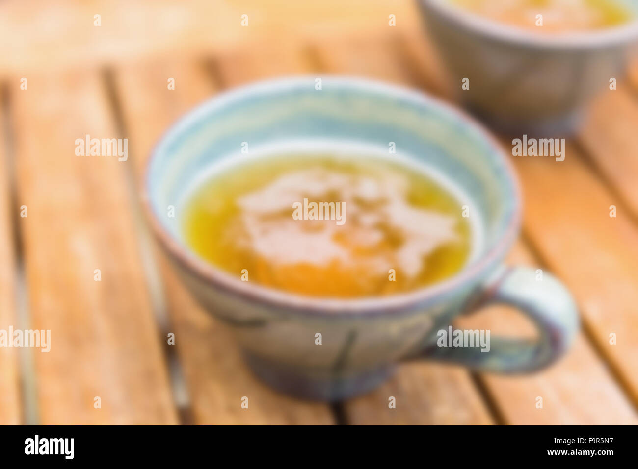 Norman apple cider in a typical ceramic cups. Defocused Shot Stock ...