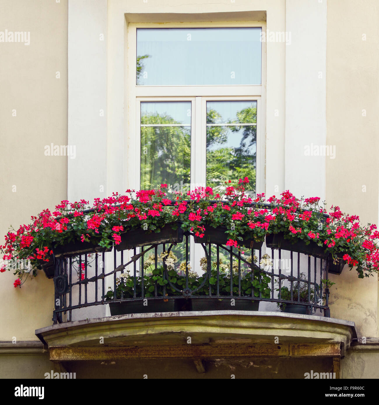 Balcony with red flowers hi-res stock photography and images - Alamy