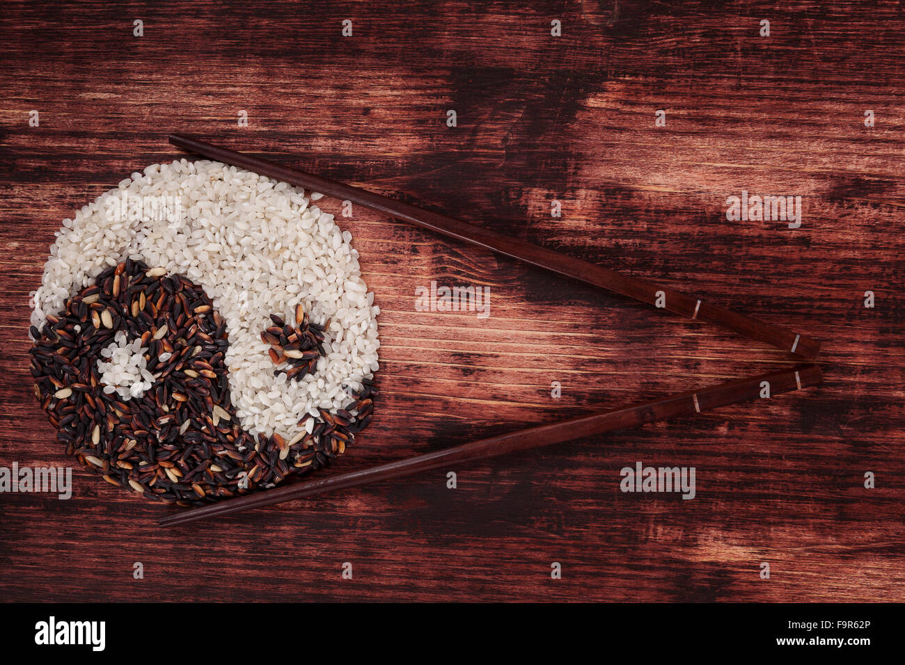 Black and white rice forming a yin yang symbol Stock Photo - Alamy