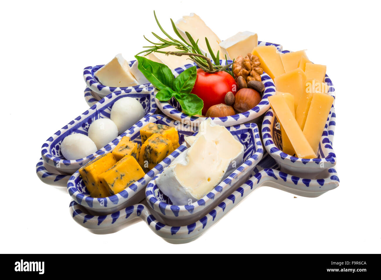 Variety cheese assortment with nuts and herbs Stock Photo - Alamy
