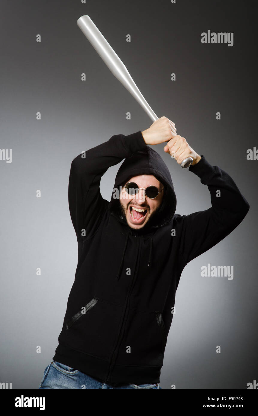 Aggressive man with basebal bat Stock Photo - Alamy