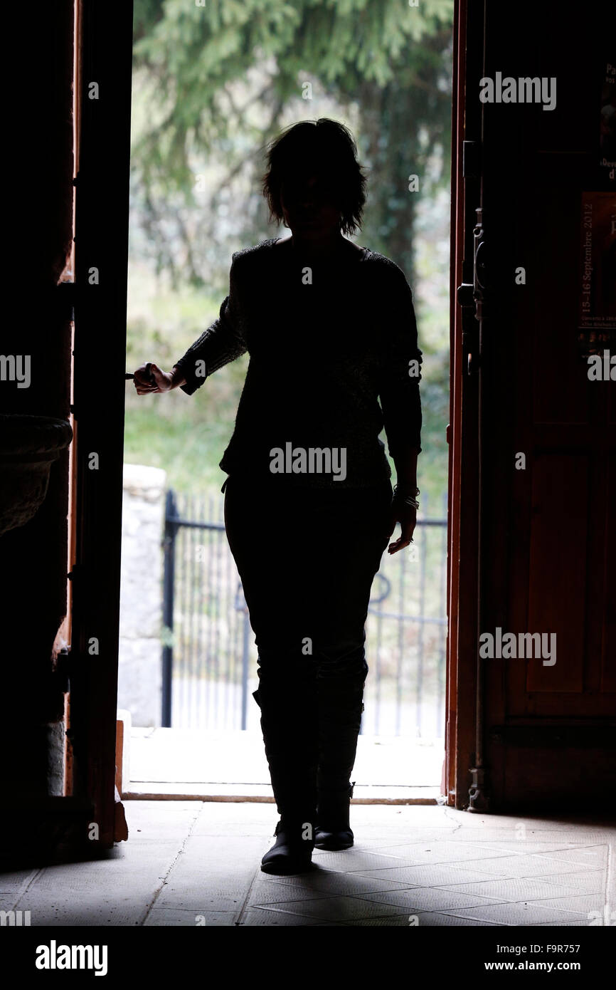 Woman leaving a church Stock Photo - Alamy
