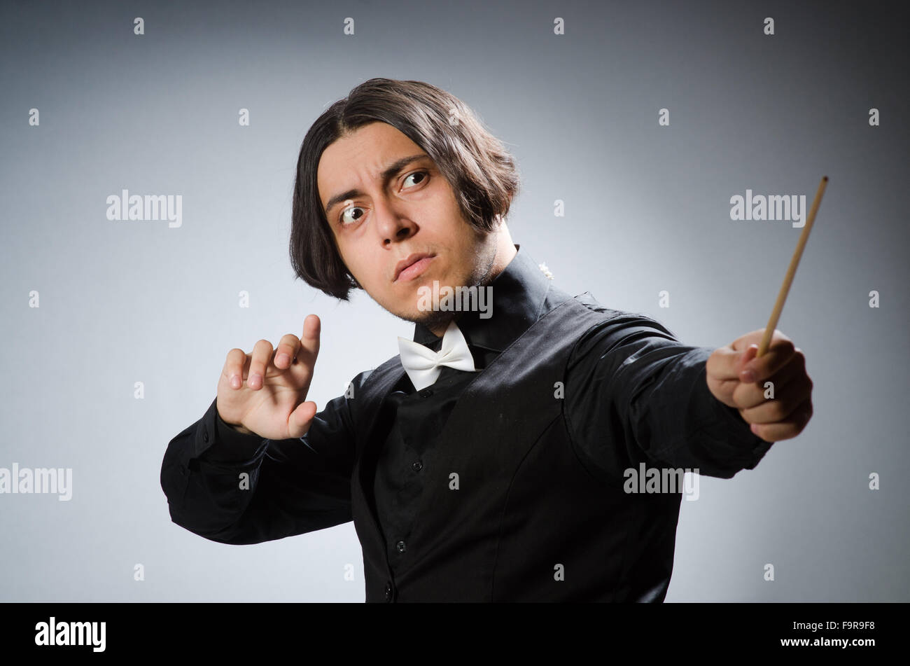 Funny conductor in musical concept Stock Photo - Alamy