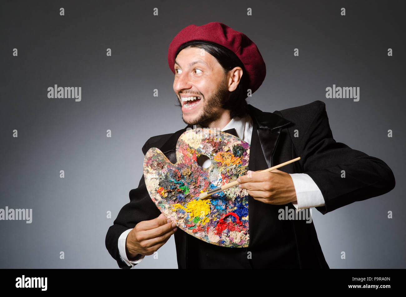 Funny artist working in the studio Stock Photo - Alamy