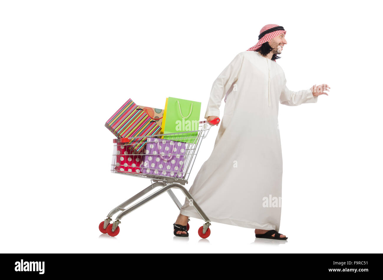 Arab man doing shopping isolated on white Stock Photo - Alamy
