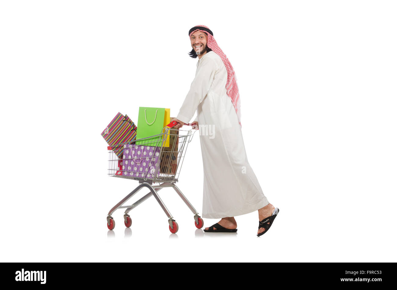 Arab man doing shopping isolated on white Stock Photo - Alamy