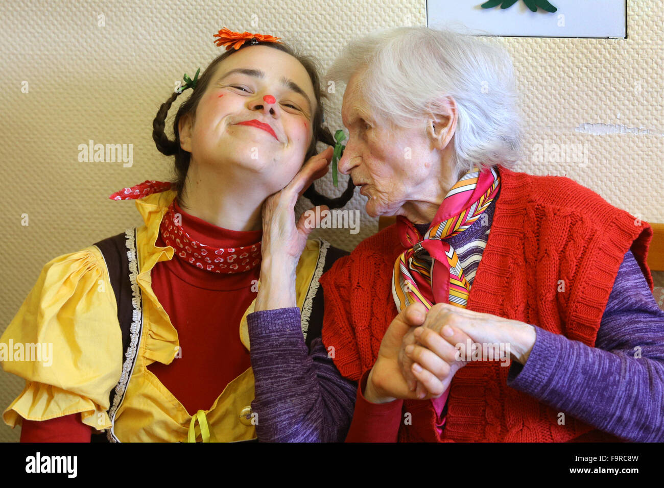 A music clown sings with old people with dementia in a hospital in ...