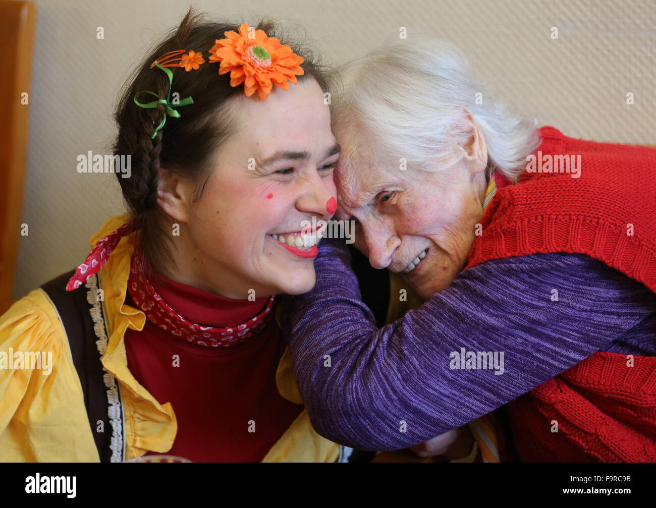 A music clown sings with old people with dementia in a hospital in ...