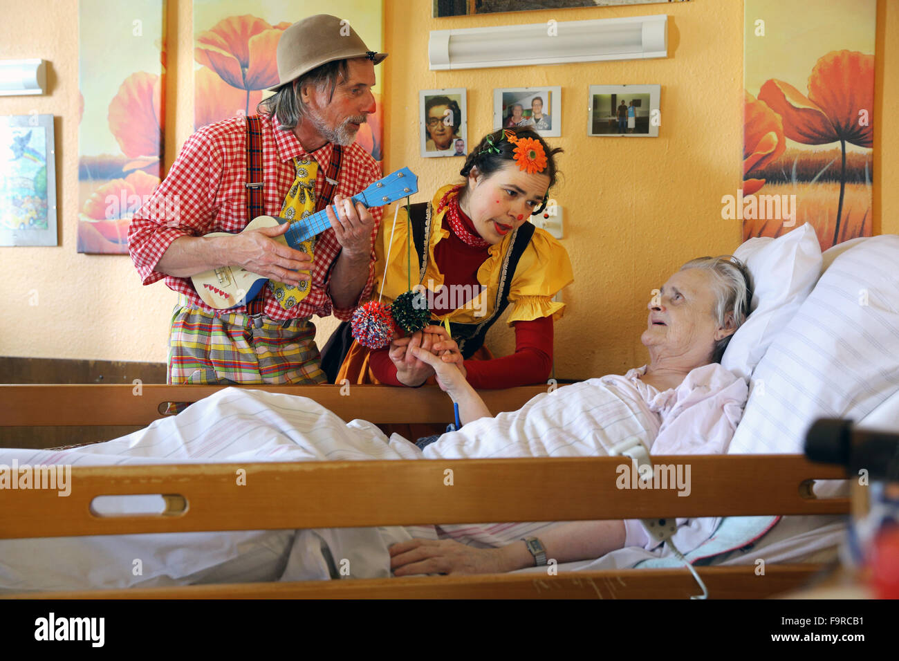 Two music clowns visit and sing with old people with dementia in a ...