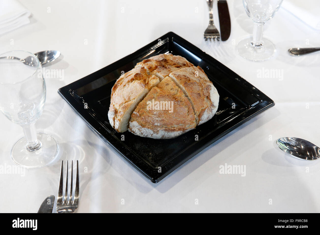 Loaf on a dinner table Stock Photo - Alamy