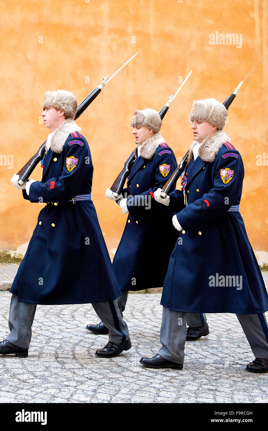 Three guards marching past wall whilst changing at Prague Castle, Czech ...