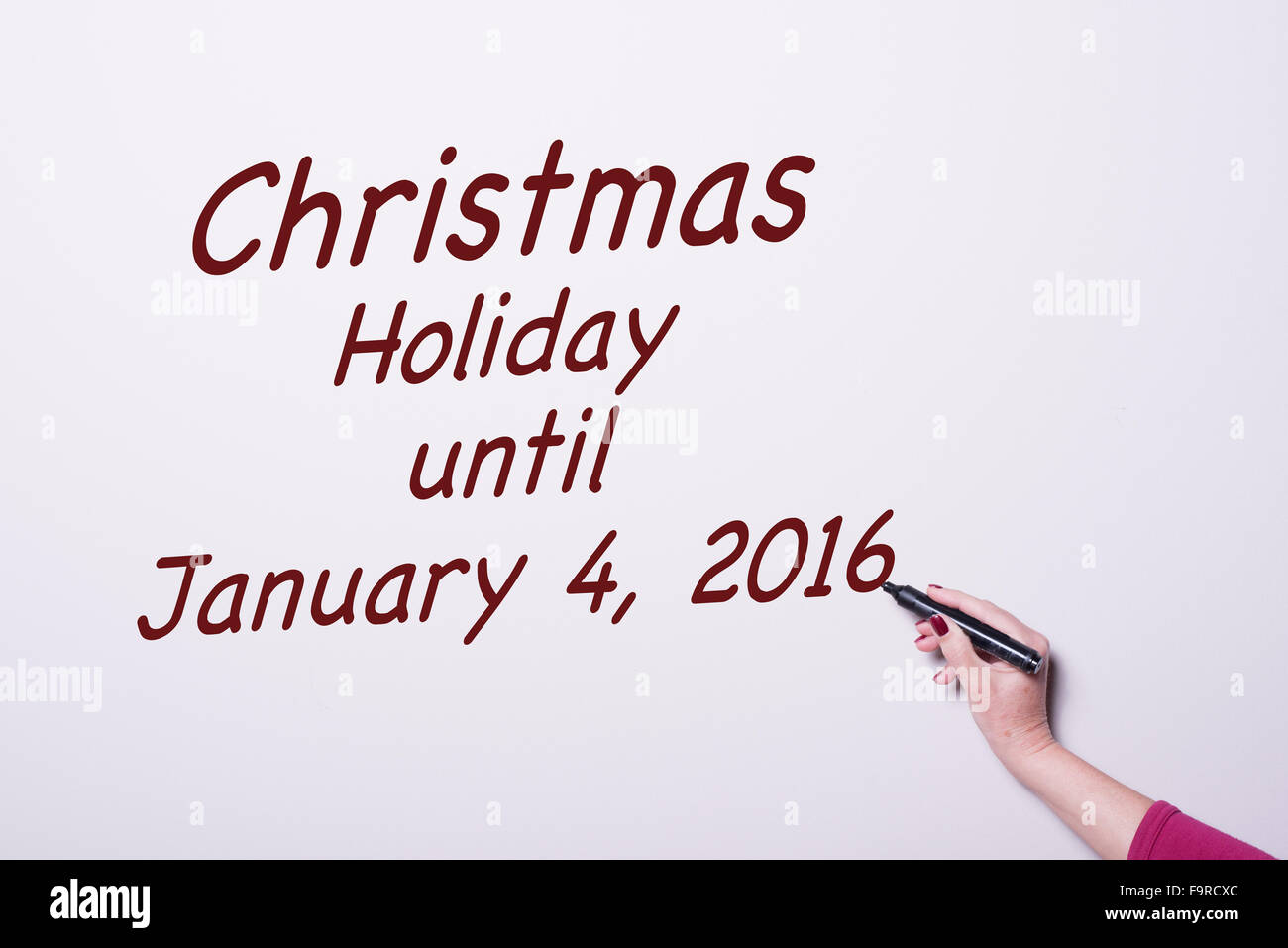 woman's hand with pen on whiteboard writing Chrismas Holiday Stock ...