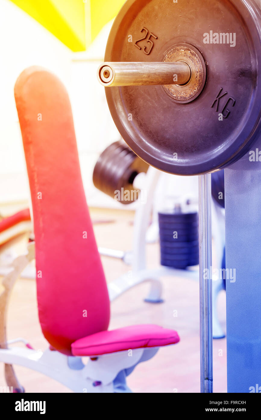 Detail of bar and bench for bench press in gym Stock Photo - Alamy