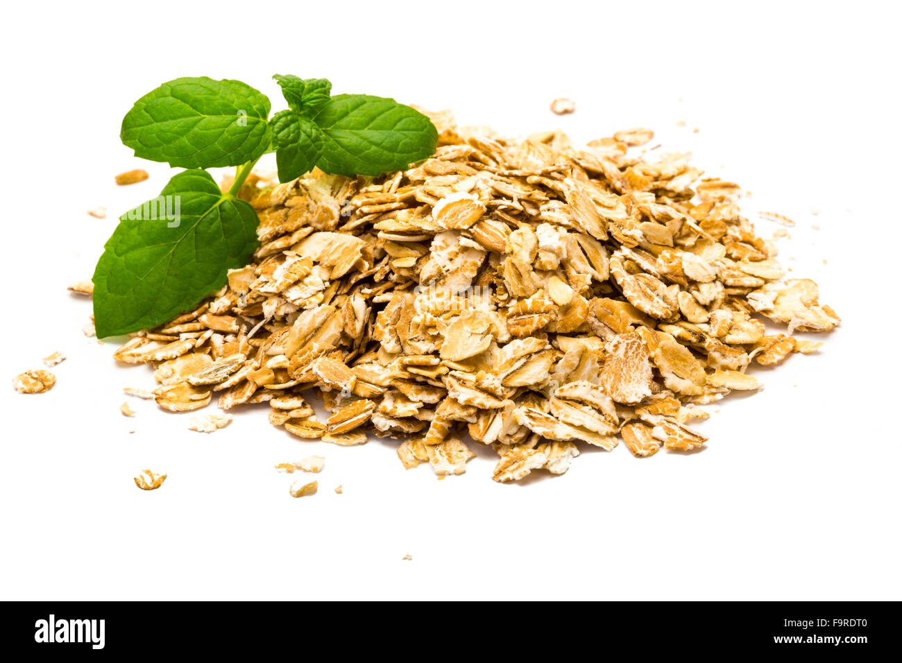 Oats pile with mint branch Stock Photo - Alamy