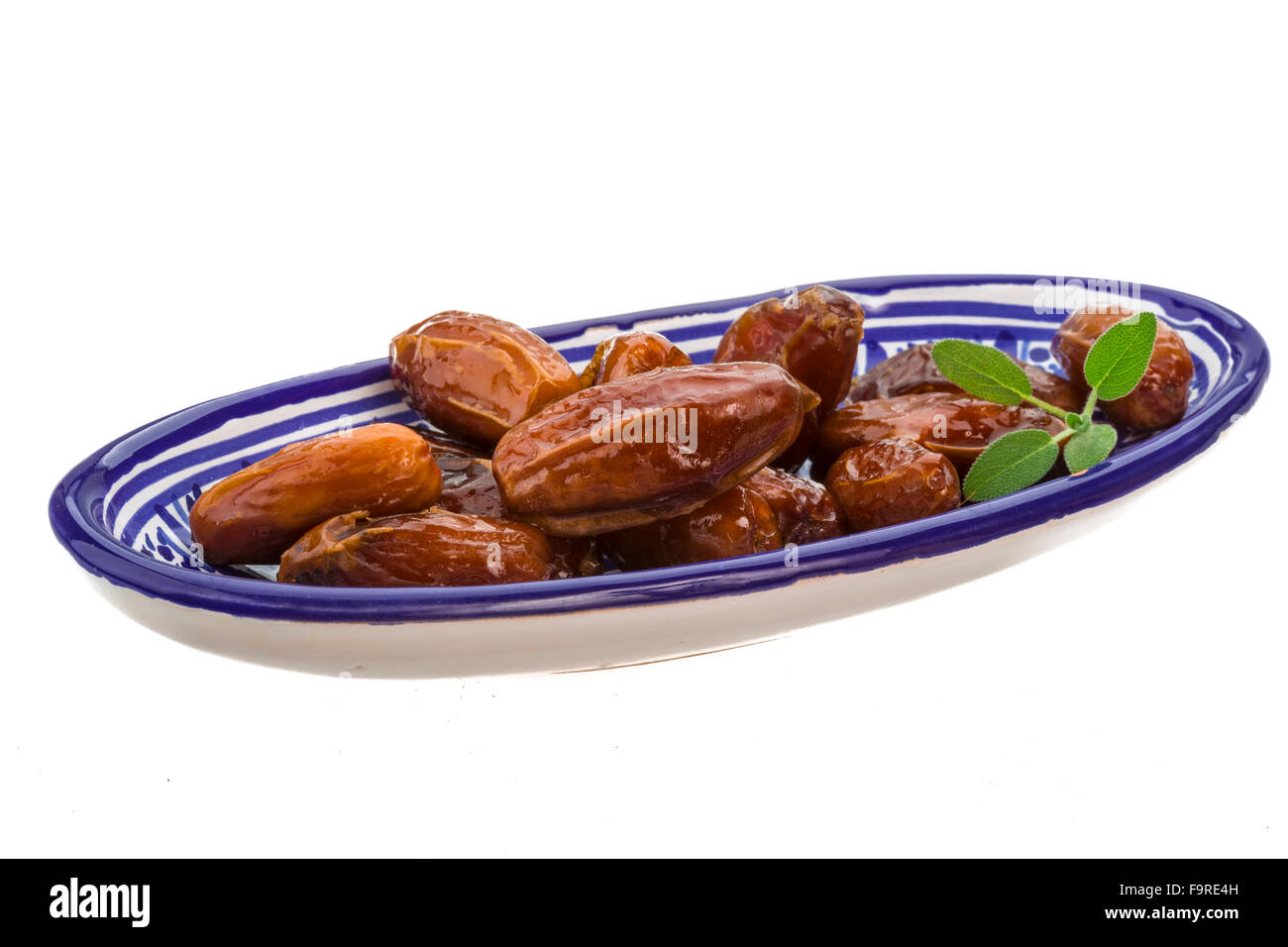 Dates with leaf on the plate Stock Photo - Alamy