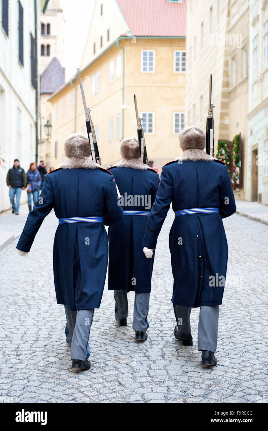 Three guards marching past wall whilst changing at Prague Castle, Czech ...