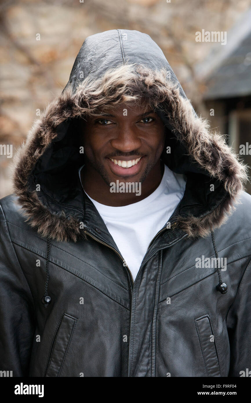 Happy young man with his hood up Stock Photo - Alamy