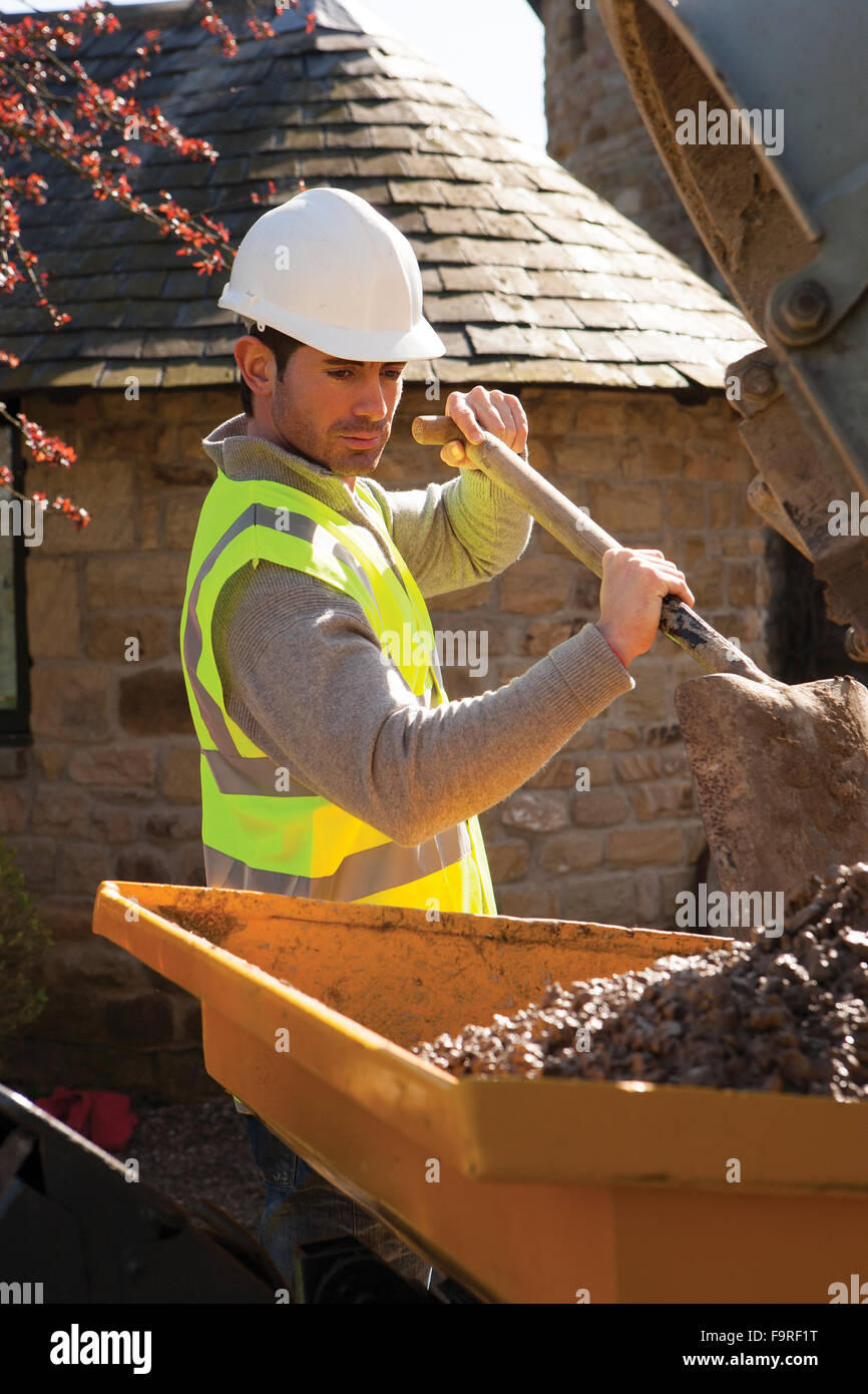 Male construction worker mixing in heavy machinery Stock Photo - Alamy