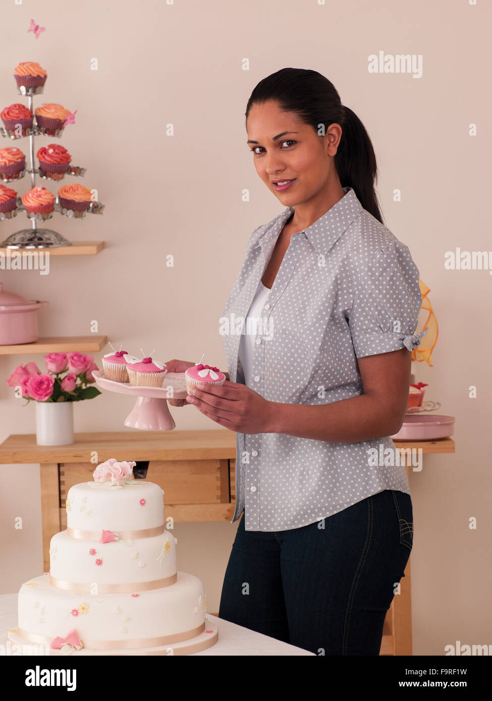 Woman baking cakes at home Stock Photo - Alamy