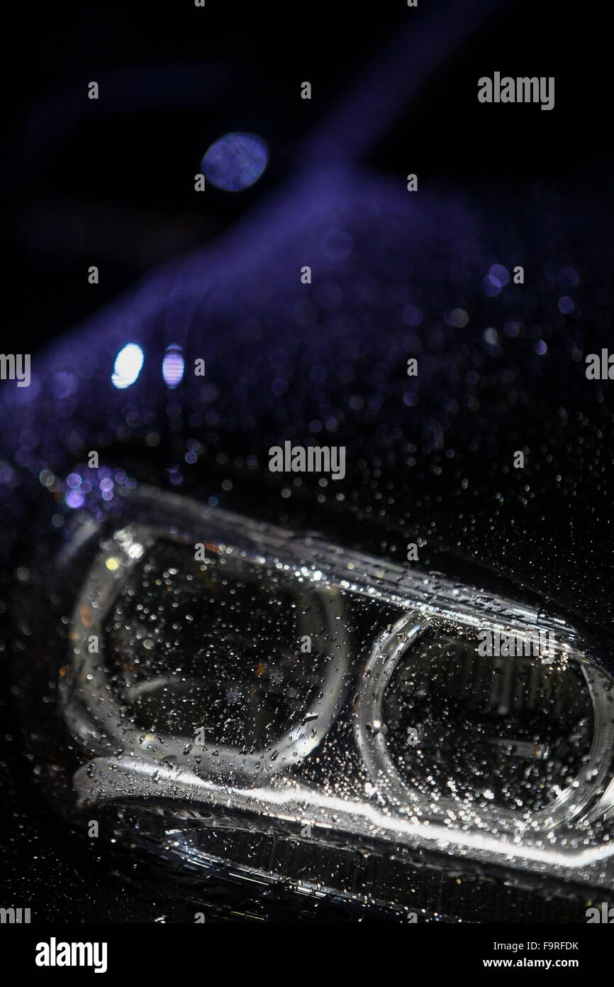 Color image of a car's headlight, covered with rain drops Stock Photo ...