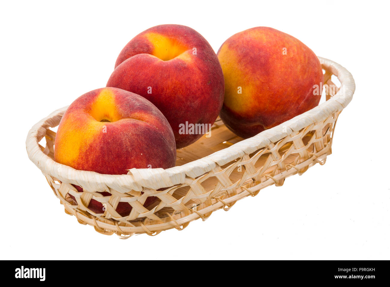 Peaches in the bowl isolated Stock Photo - Alamy