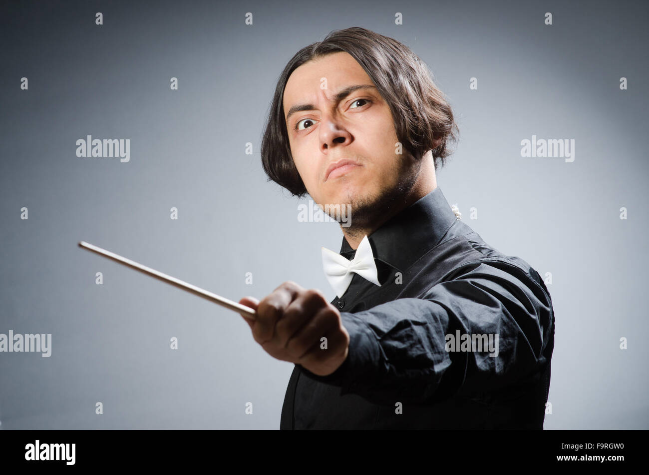 Funny conductor in musical concept Stock Photo - Alamy