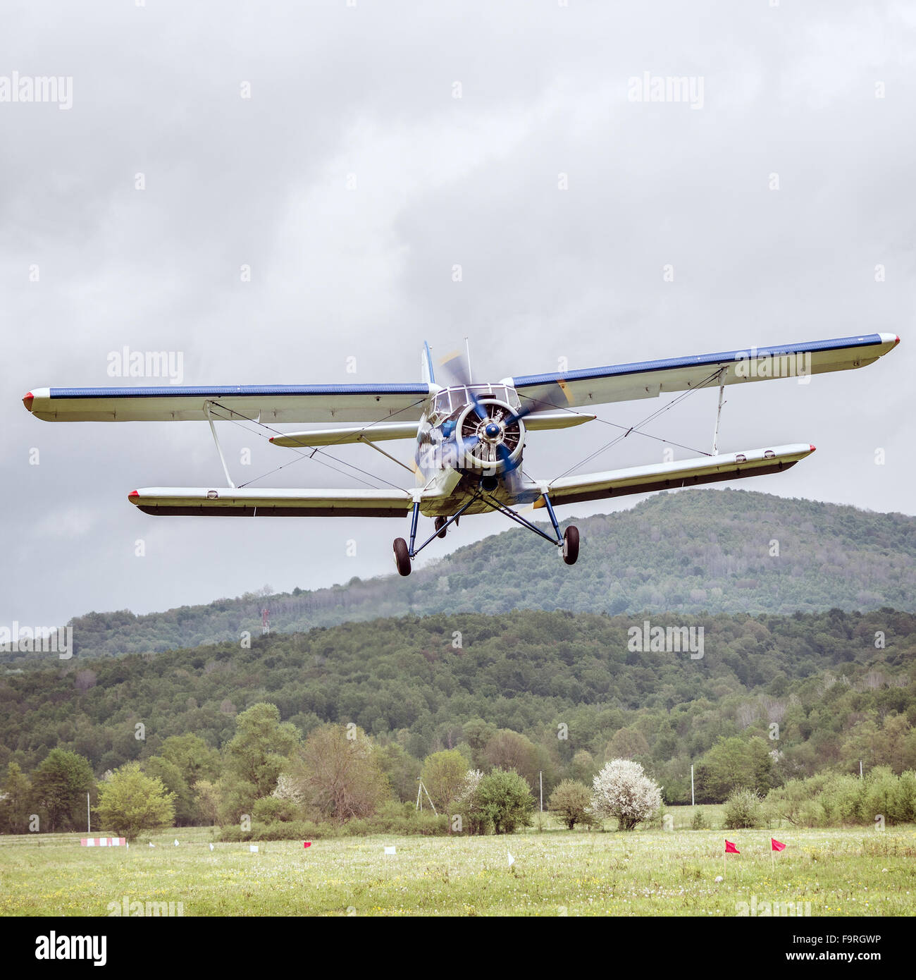 Flight of the old retro plane after taking off Stock Photo - Alamy