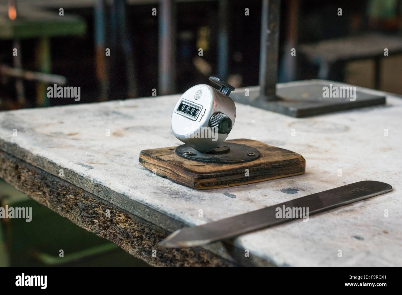 Mechanical counter on a workbench at a glass blowing manufacture ...