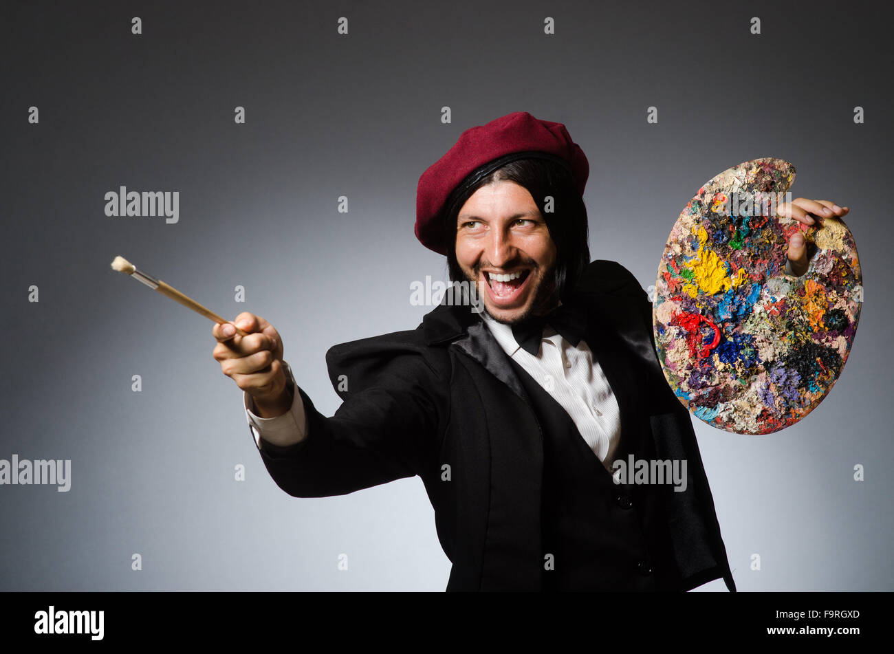 Funny artist working in the studio Stock Photo - Alamy